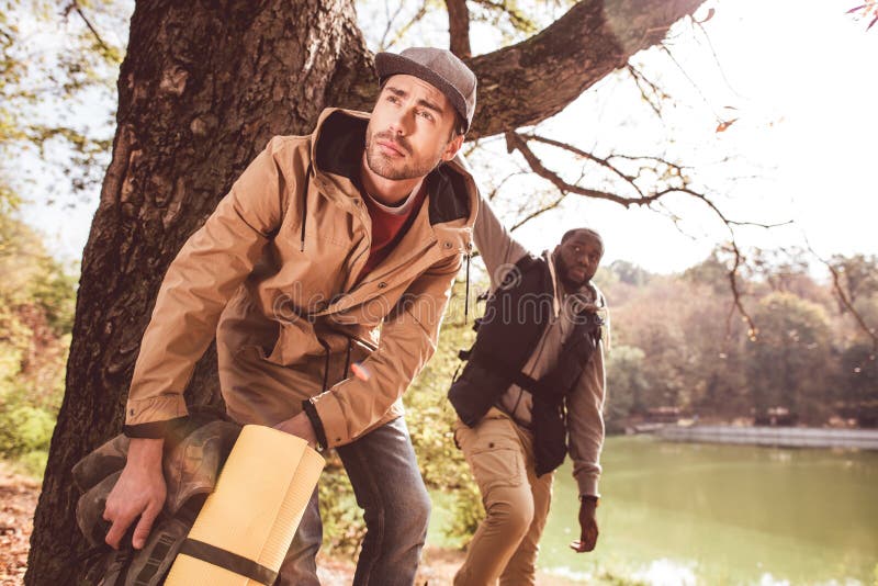 Men Backpackers Standing Near River Stock Photo - Image of travelling ...