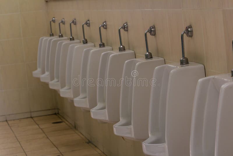 Men Bathroom with Row of White Lavatory Stock Photo - Image of white ...