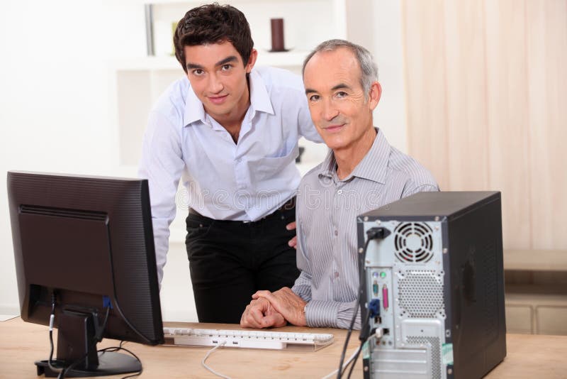 Two men with a computer stock photo. Image of computer - 33679246