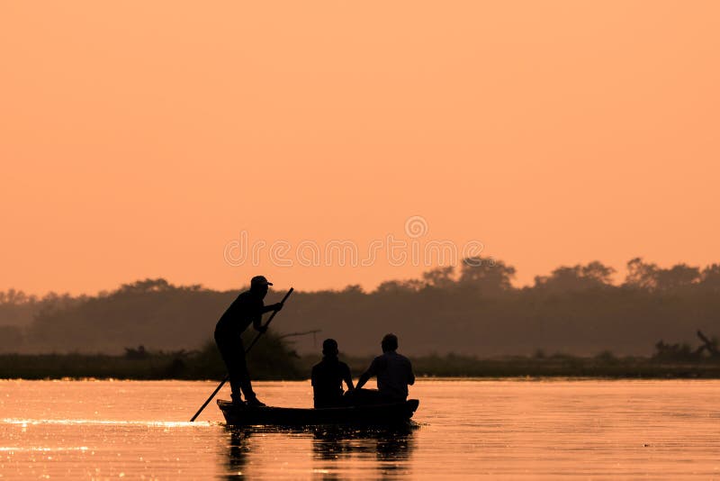 Men in a Boat on a River Silhouette Editorial Stock Photo - Image of ...