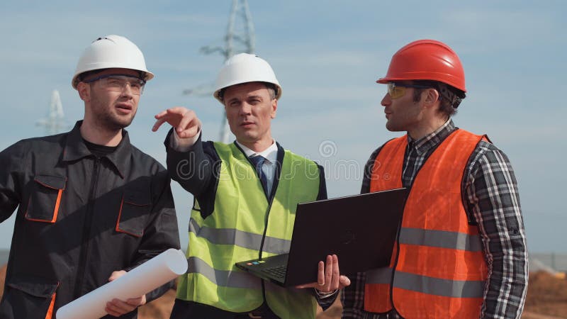Men on Building Site Discussing the Blueprint Stock Image - Image of ...
