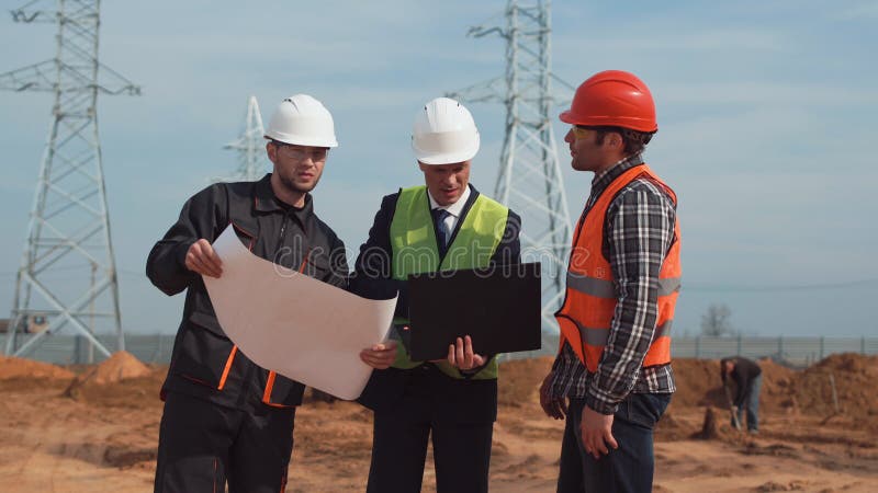 Men on Building Site Discussing the Blueprint Stock Image - Image of ...
