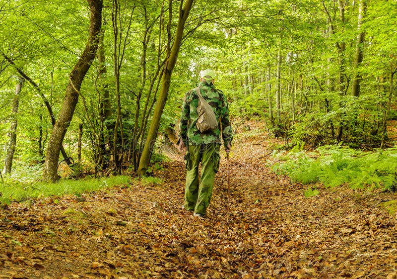 Men in Camouflage with Backpack and Cane Walking through the for Stock ...