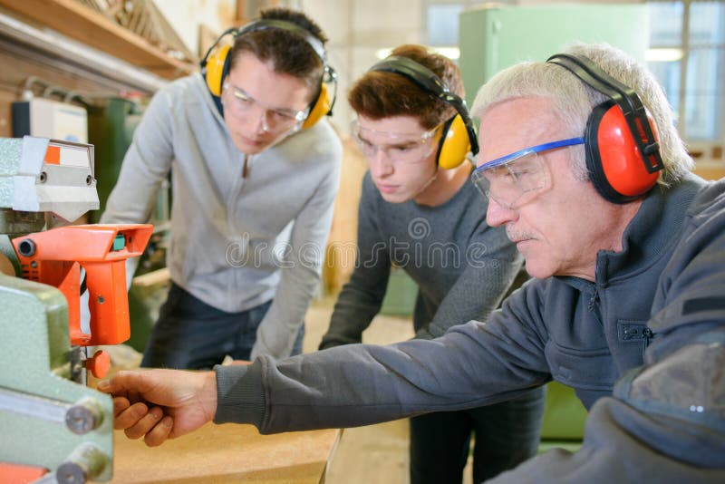 Men on carpentry class stock photo. Image of safety - 272480804