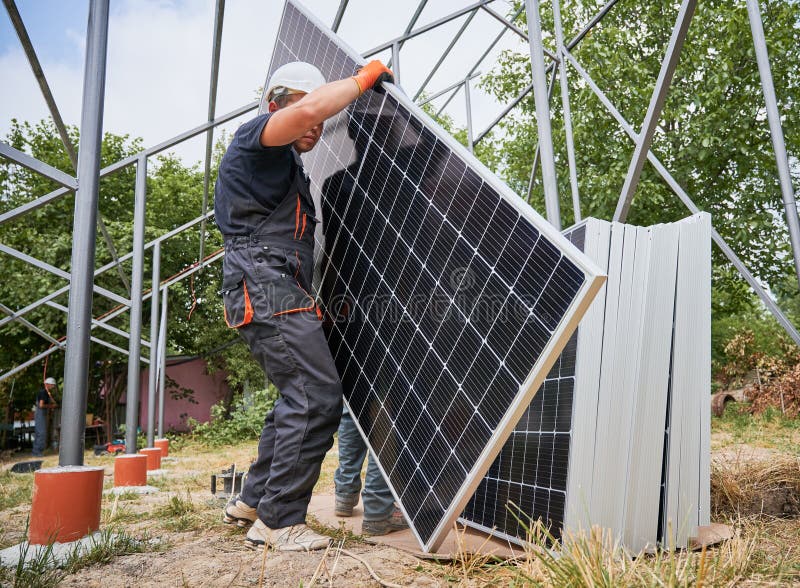 Men Carrying Solar Panels for Installing in Field Stock Photo - Image ...