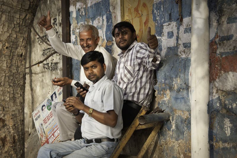 Men with cell phones editorial image. Image of observing - 27730270