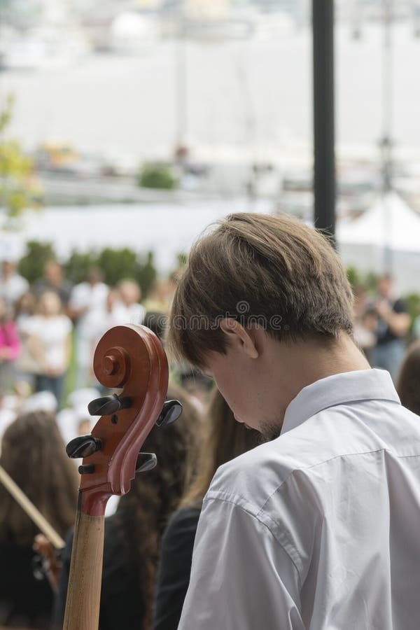 Men with a Cello in an Orchestra. Vertical Photo Editorial Stock Image ...