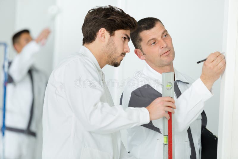 Men Checking Wall with Professional Aluminum Level Stock Image - Image ...