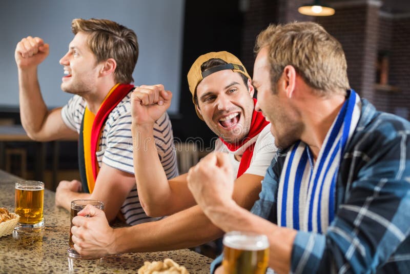 Men cheering with beers stock image. Image of pleasure - 67730667