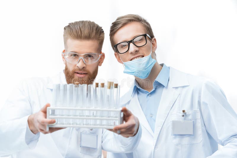 Men Chemists in Lab Coats Holding Test Tubes and Smiling at Camera ...