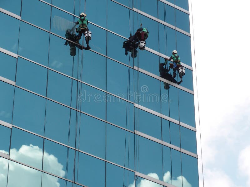 Men Cleaning Glass Building Stock Image - Image of harness, cleaning ...