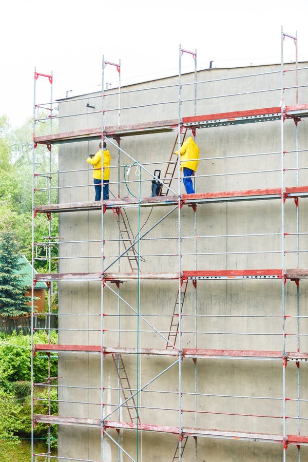 Men Cleaning Wall. Scaffolding Stock Image - Image of unfinished, steel ...