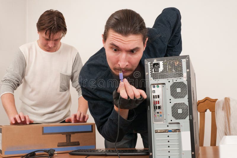 Men and the computer. stock photo. Image of brothers - 13157042