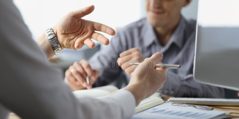 Men are Discussing at Table in Office and Gesturing Closeup Stock Photo ...