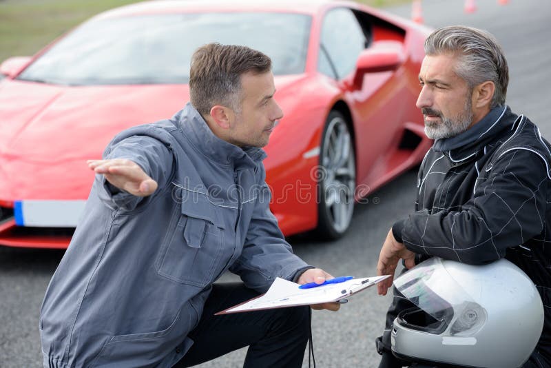 Men in Discussion Sports Car in Background Stock Image - Image of urban ...