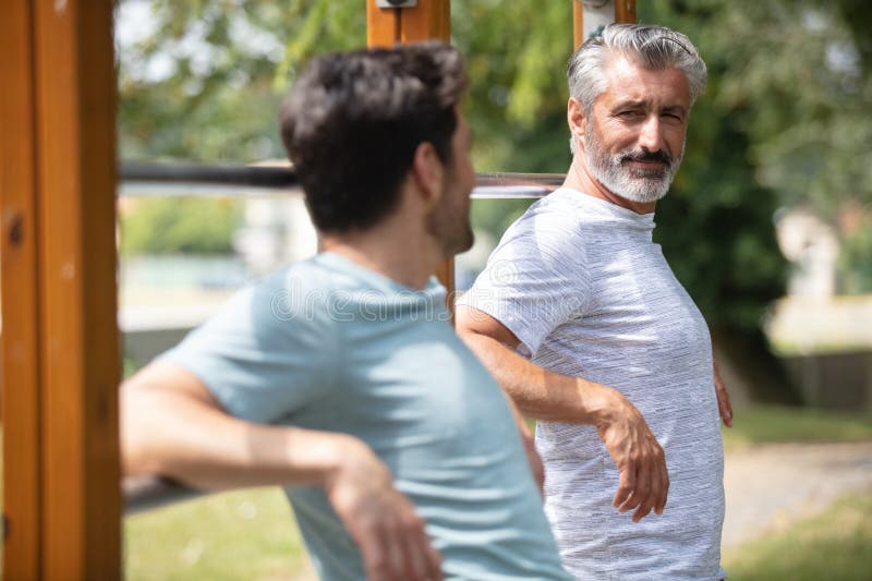 Men Doing Dips at Outdoor Morning Workout Stock Image - Image of ...