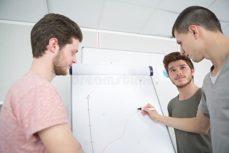 Men drawing a graph stock photo. Image of analyze, young - 256657530