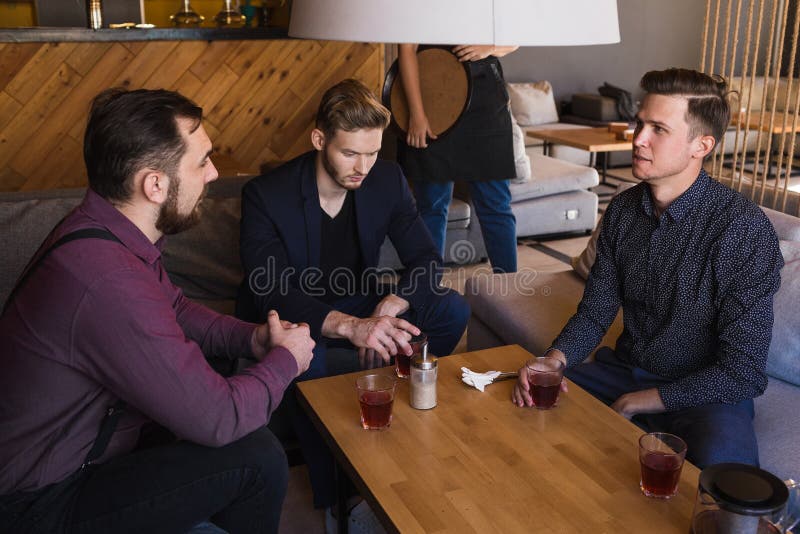 Men Drink Tea in a Stylish Loft Cafe with a Modern Design Stock Image ...