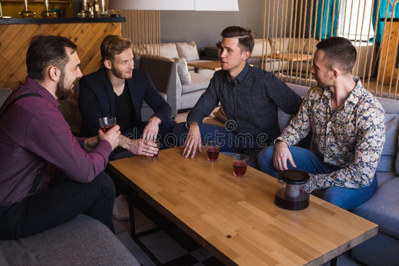 Men Drink Tea in a Stylish Loft Cafe with a Modern Design Stock Photo ...