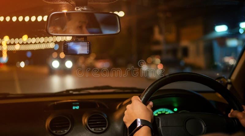 Men driving a car at night stock image. Image of black - 188358295