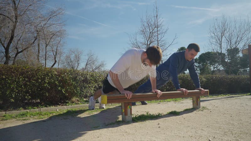 Men Engaging in Physical Activity Outside Completing a PushUp Workout ...