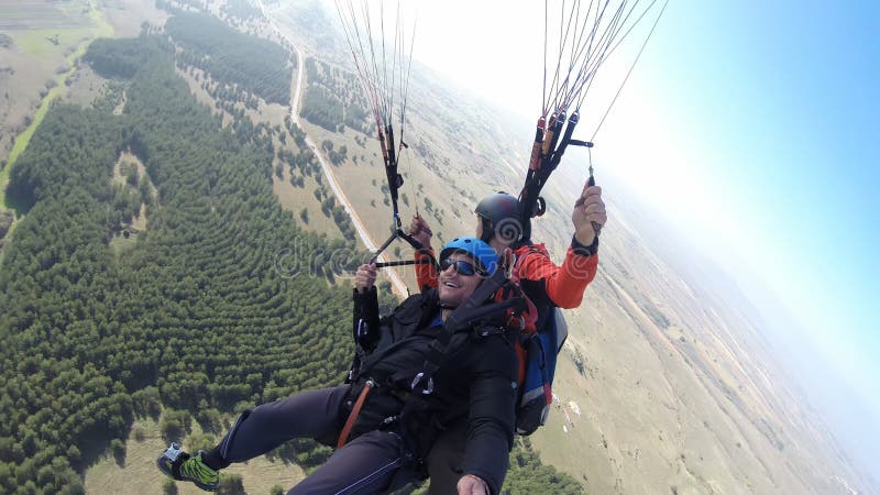 Men Enjoying while Paragliding Stock Photo - Image of paraglider ...