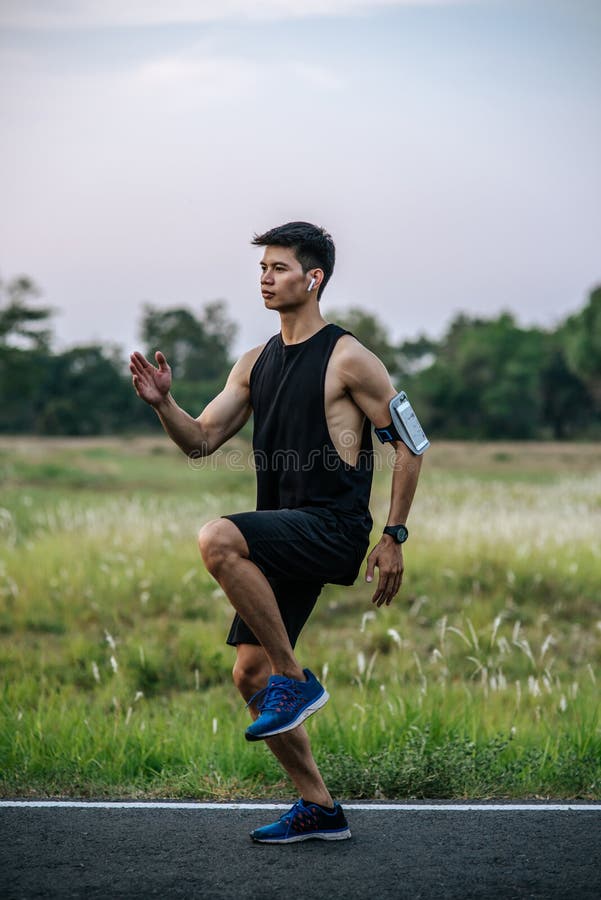 Men Exercise by Running and Lifting Their Knees Forward Stock Photo ...