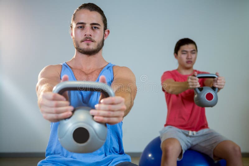 Men Exercising on Exercise Ball Stock Photo - Image of effort, club ...