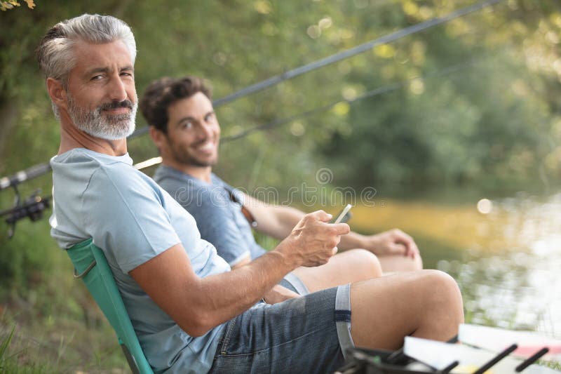 Men Fishing Standing on Lakeshore Stock Photo - Image of lifestyle ...