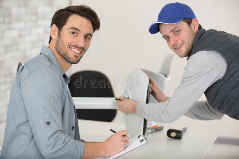 Men Fixing Caster Roller Wheel Wheel Stock Photo - Image of floor ...