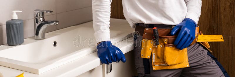 Men Fixing a Sink in Bathroom Stock Photo - Image of toilet ...