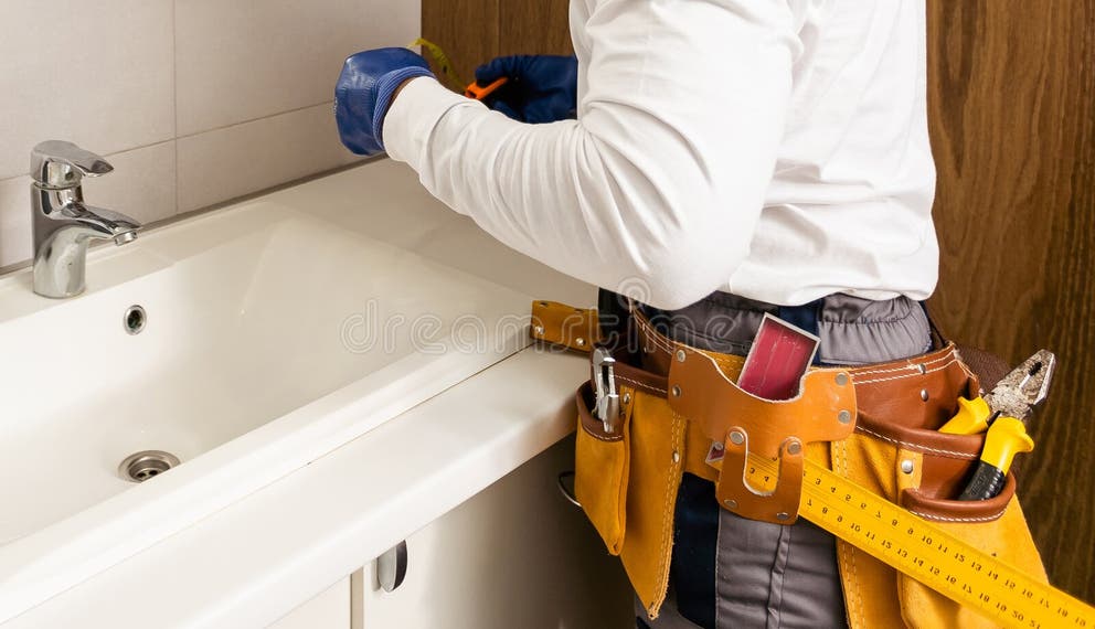 Men Fixing a Sink in Bathroom Stock Photo - Image of plumbing, indoors ...