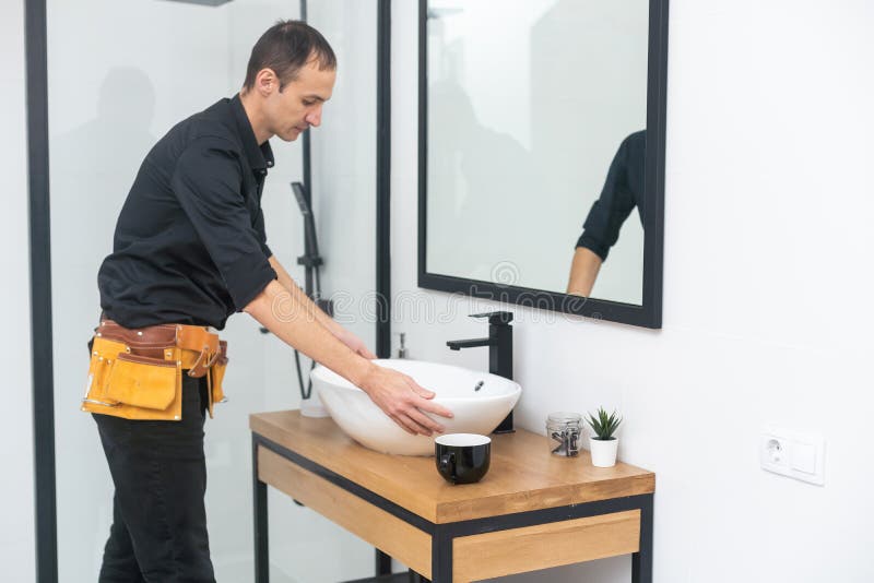Men Fixing a Sink in Bathroom Stock Photo - Image of mechanic, pipe ...