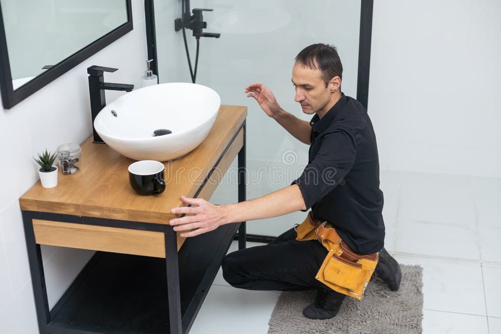 Men Fixing a Sink in Bathroom Stock Image - Image of occupation ...