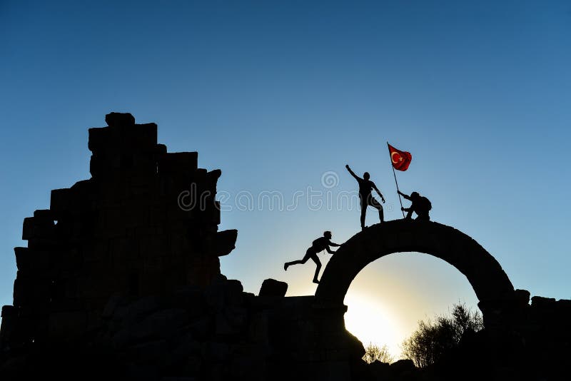 Men with Flag on Stone Arch Stock Image - Image of team, arch: 128474581