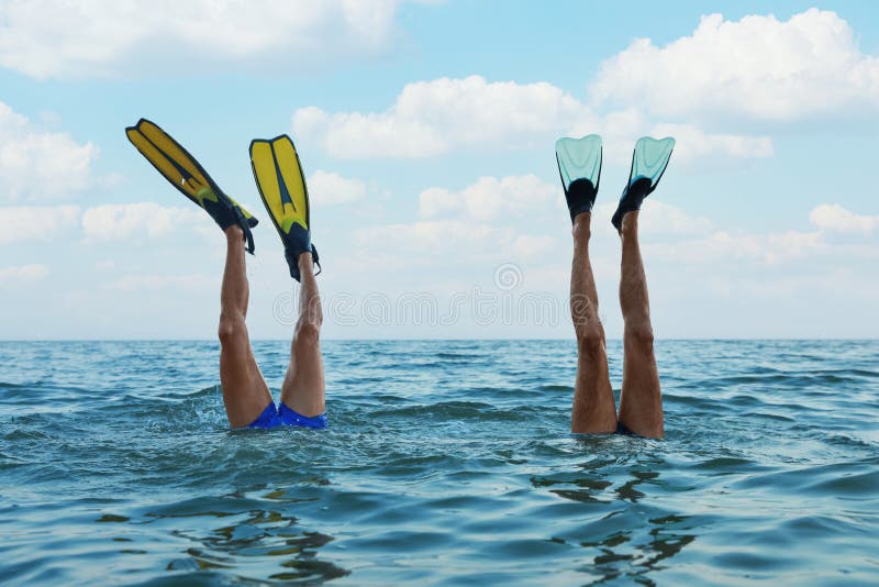Men in Flippers Diving into Sea Water Stock Image - Image of adult ...