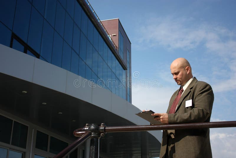 A Men in Front of a Building Stock Image - Image of white, object: 13734563