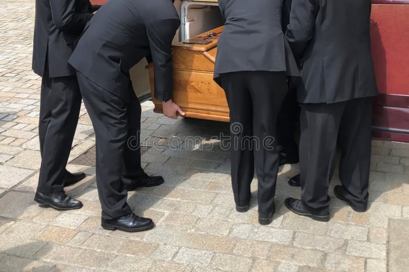 Men of Funeral Service Loading the Coffin into the Hearse Stock Photo ...