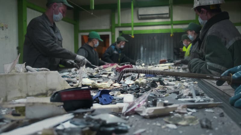 Men of Garbage Processing Plant Sort Trash. Male Workers Sort, Recycle ...