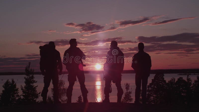 Men with Guns at Sunset. Shot with Red Camera Stock Photo - Image of ...