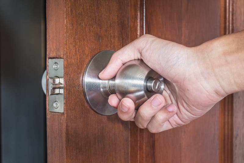 Men hand open the door stock image. Image of keyhole - 130588477