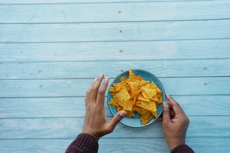 Men Hand Pick Potato Chips from a Plate Stock Image - Image of snack ...