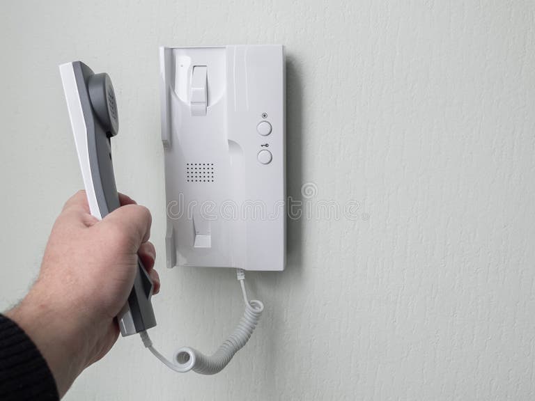 Men Hand Picks Up Intercom Receiver in Apartment Stock Image - Image of ...