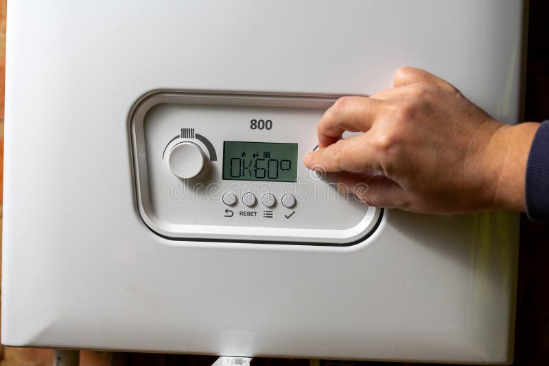 Men Hand Setting Temperature Button on Control Panel of Central Heating ...