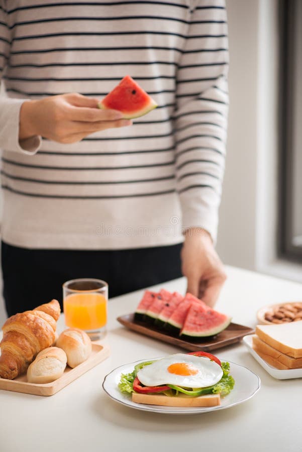Men Having Breakfast with Toasts at Table Stock Photo - Image of snack ...