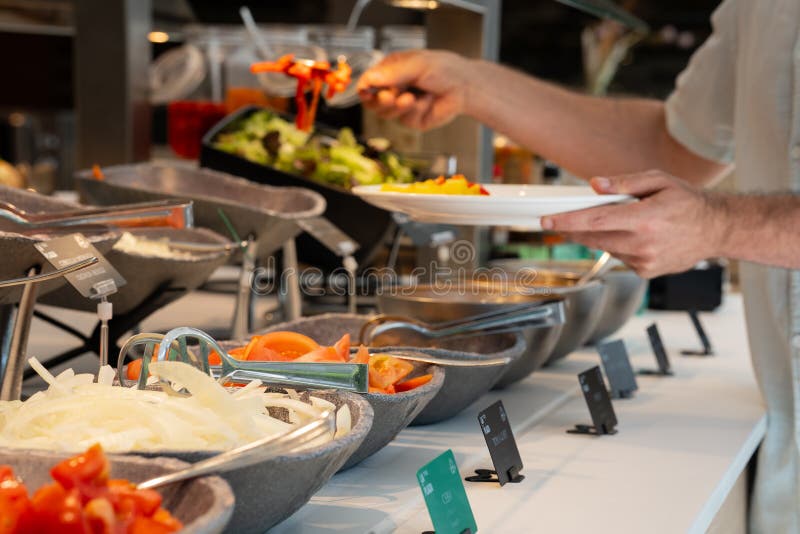 Men Helping Himself To Food at the Hotel Buffet. Stock Photo - Image of ...