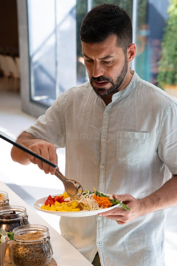 Men Helping Himself To Food at the Hotel Buffet. Stock Image - Image of ...