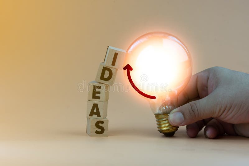 Men Holding Light Bulbs, Ideas of New Ideas with Innovative Technology ...