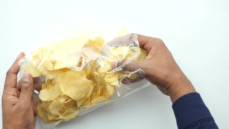 Men Holding a Open Potato Chips Packet Stock Video - Video of pick ...