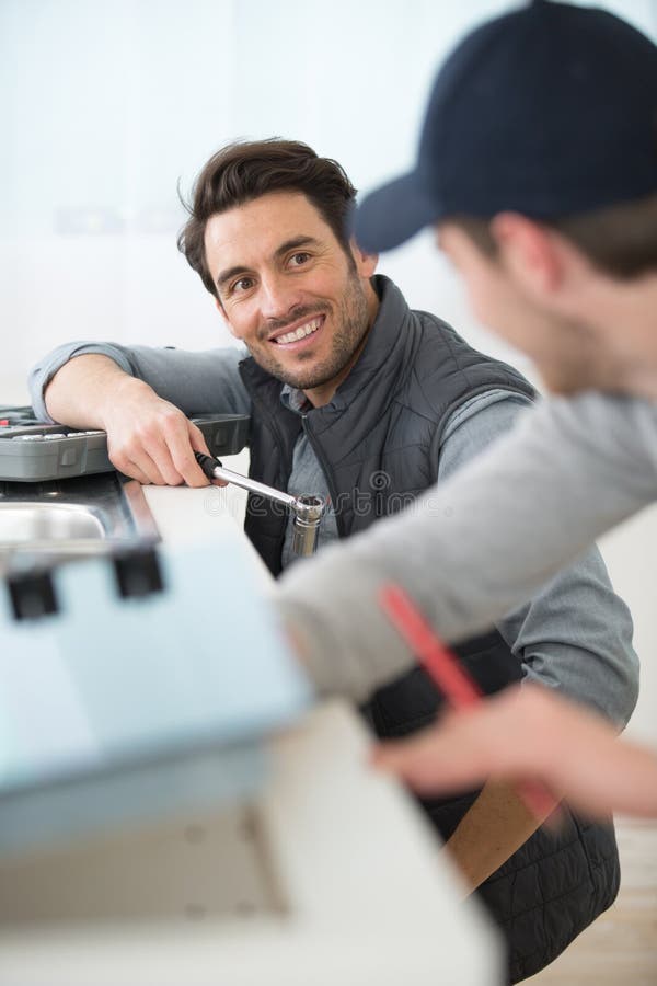 Men holding working tools stock photo. Image of maintenance - 264988068